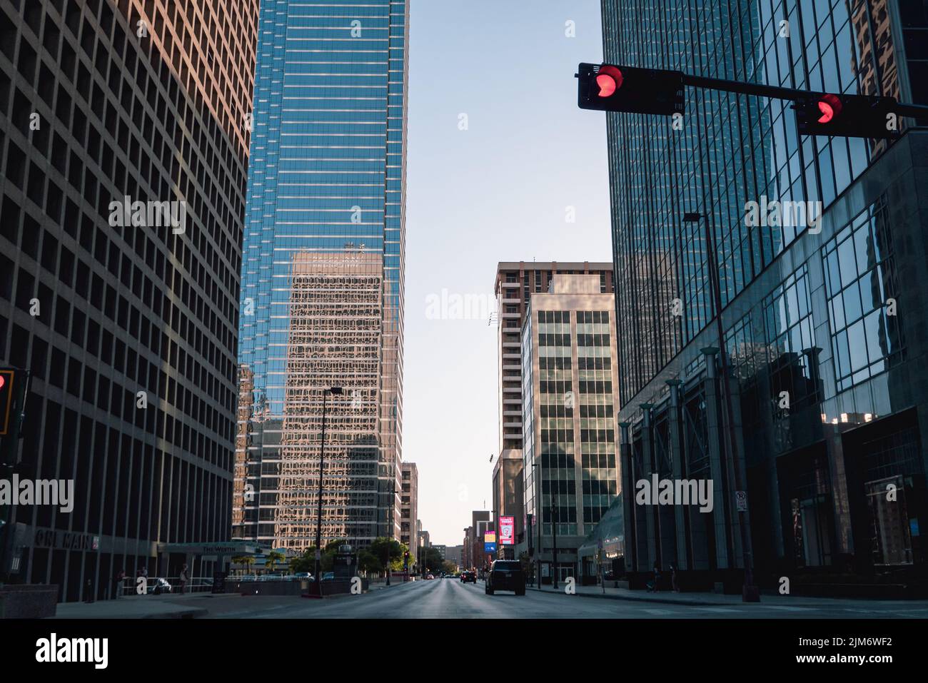 An intersection surrounded by skyline buildings in Downtown Dallas ...