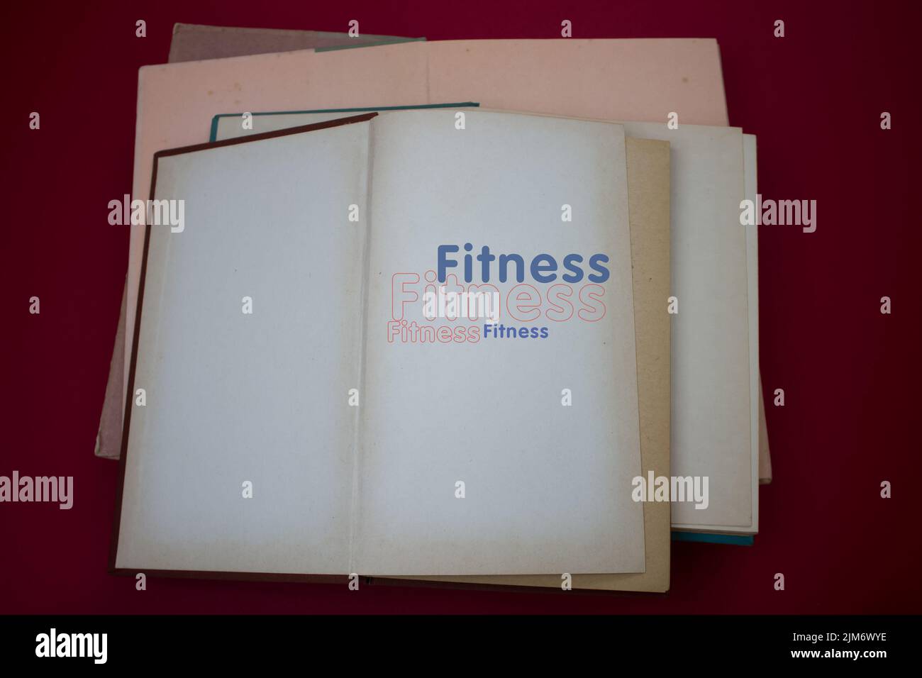 Fitness word in opened book with vintage, natural patterns old antique ...
