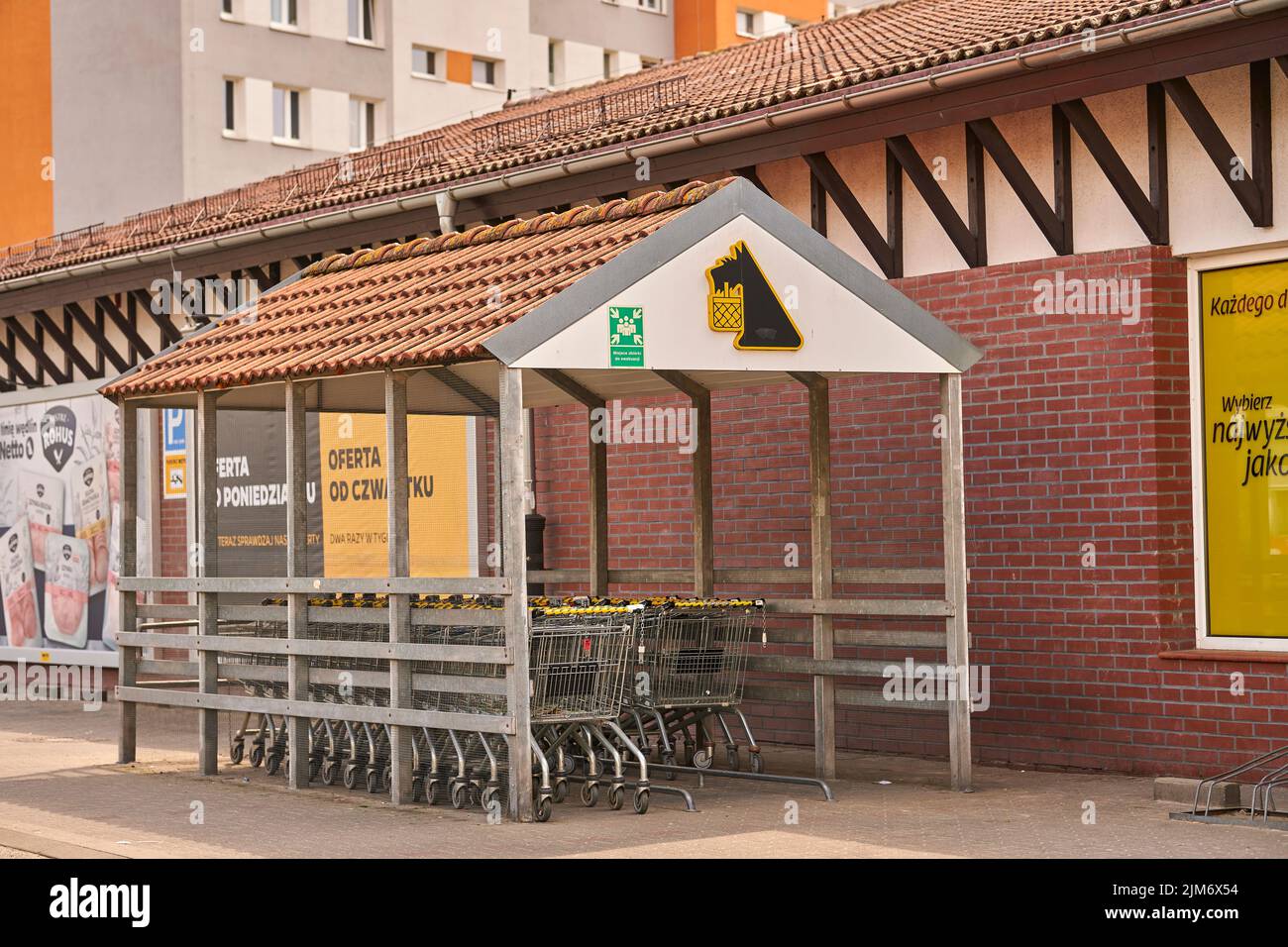 A row of shopping carts by the entrance of a Netto supermarket Stock ...
