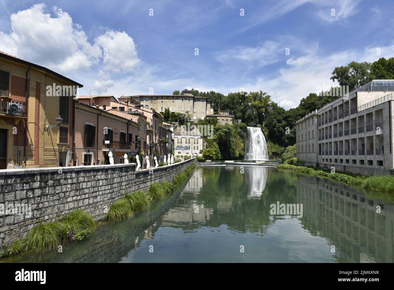 The residential buildings and a waterfall in Isola del Liri, Lazio ...