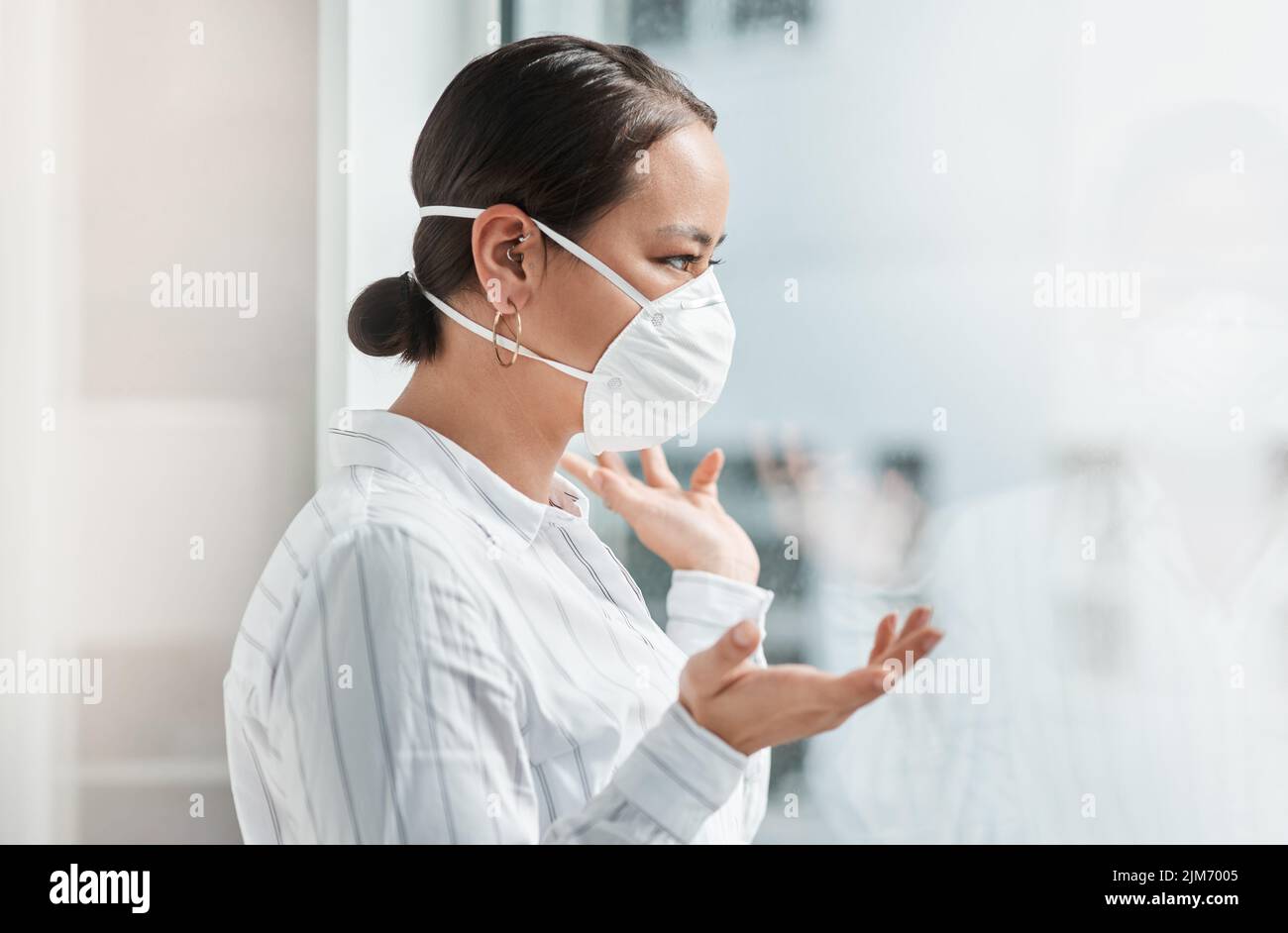 Wearing a mask Make yourself heard with body language. a masked young ...