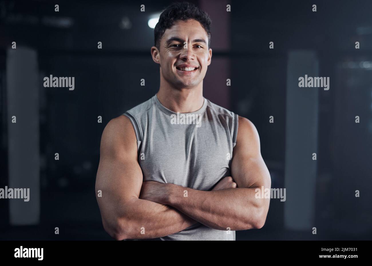 Have you met my biceps. Portrait of a confident young man at a gym ...