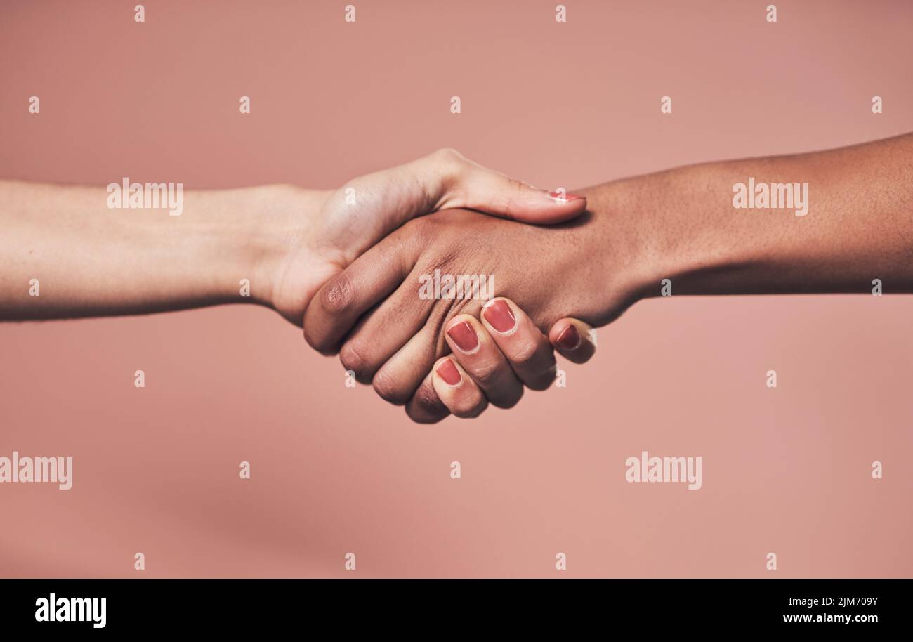 Lets do it together. two unrecognizable women shaking hands Stock Photo ...