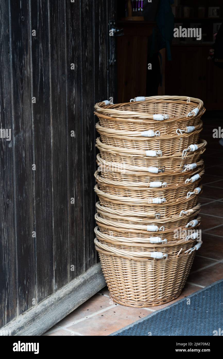 A vertical closeup of the stack of wicker baskets Stock Photo - Alamy