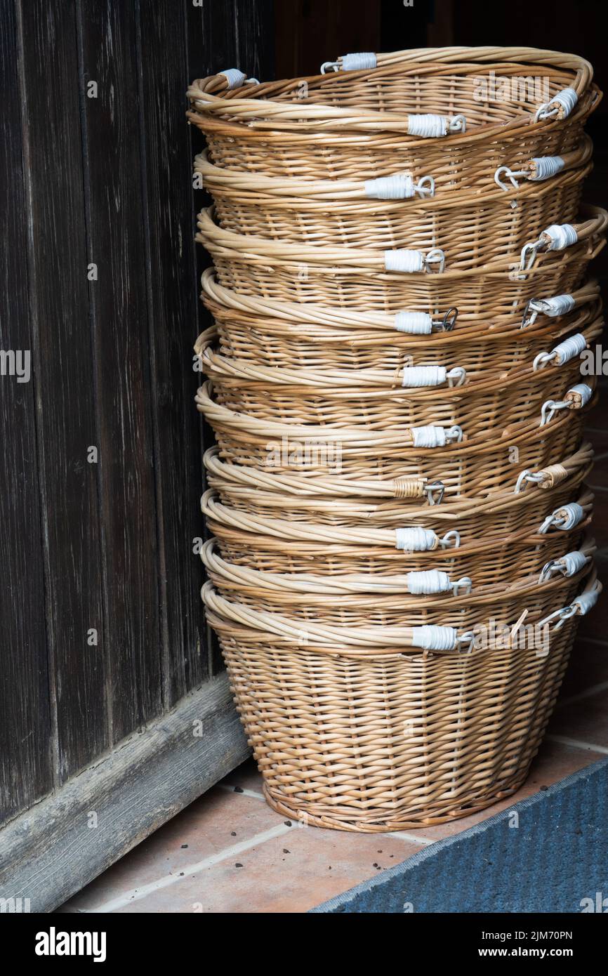 A vertical closeup of the stack of wicker baskets Stock Photo - Alamy