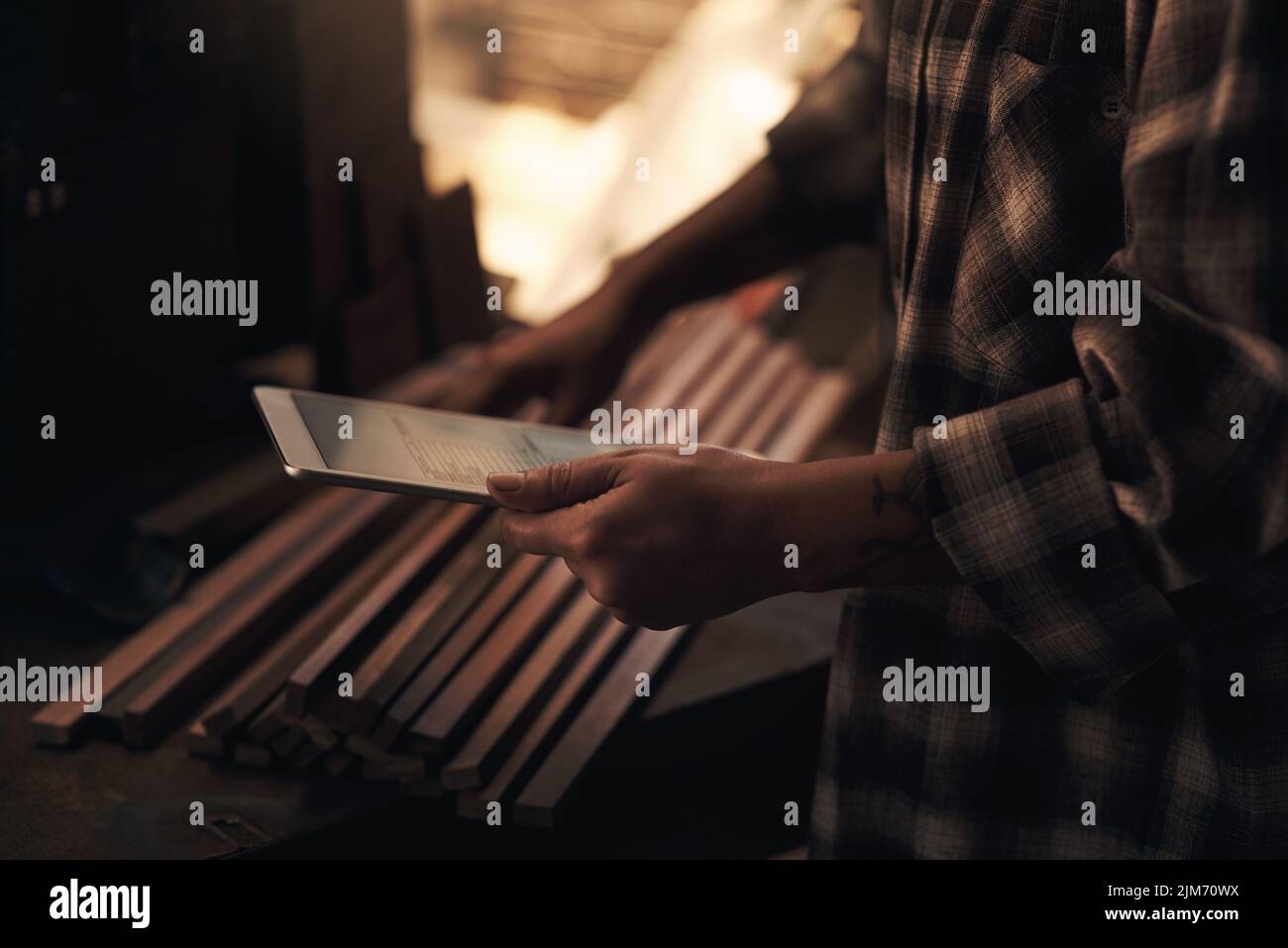 Cutting edge tech for fine craftsmanship. a woman using a digital ...