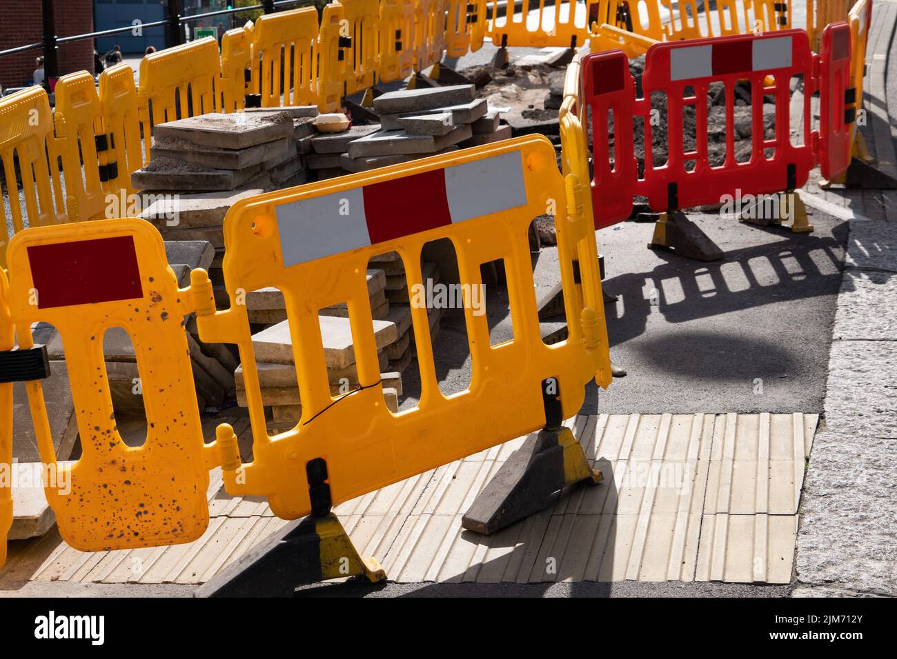 The yellow plastic road safety barriers on the street Stock Photo - Alamy