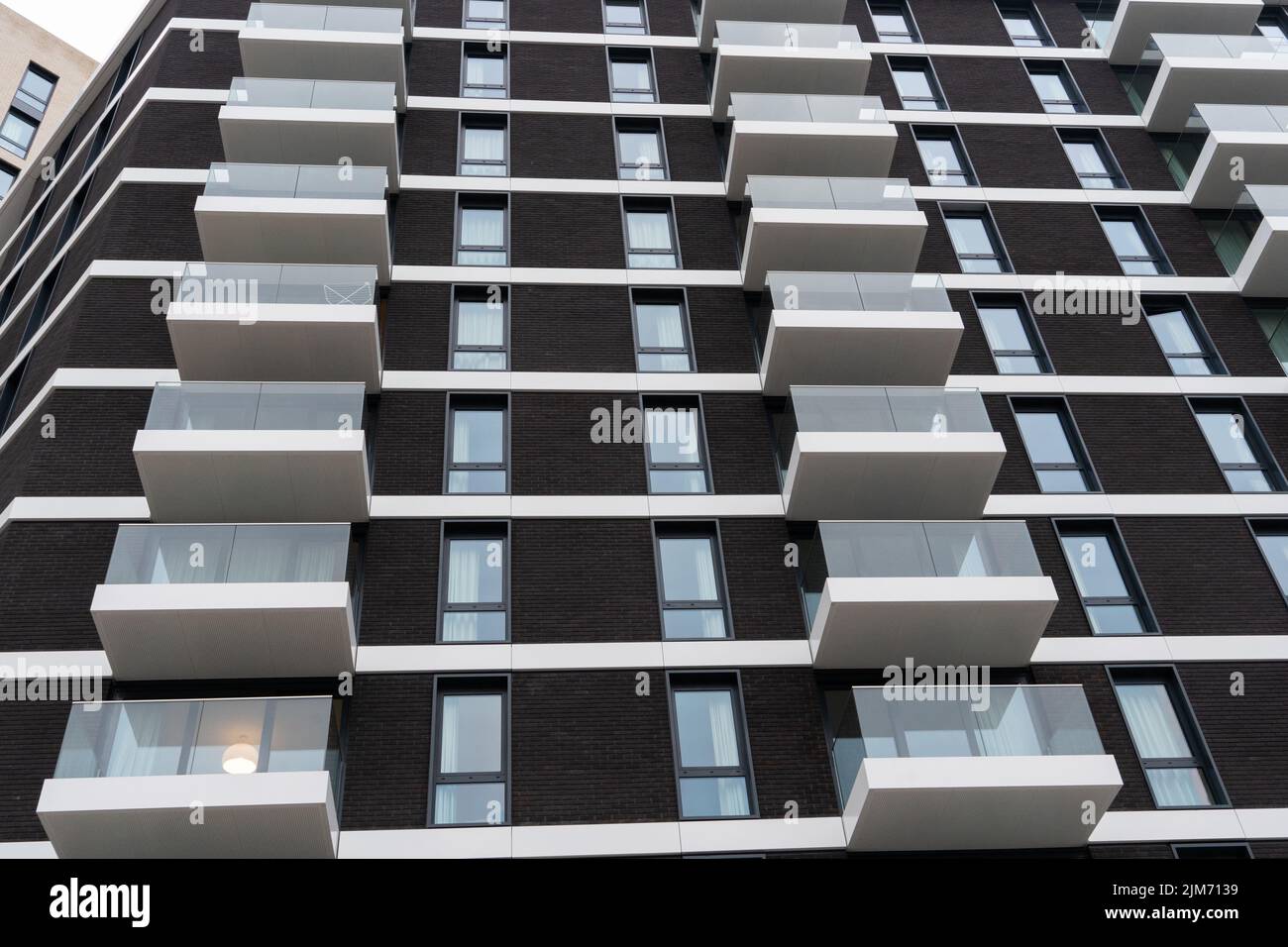 A low-angle shot of the new residential building Stock Photo - Alamy