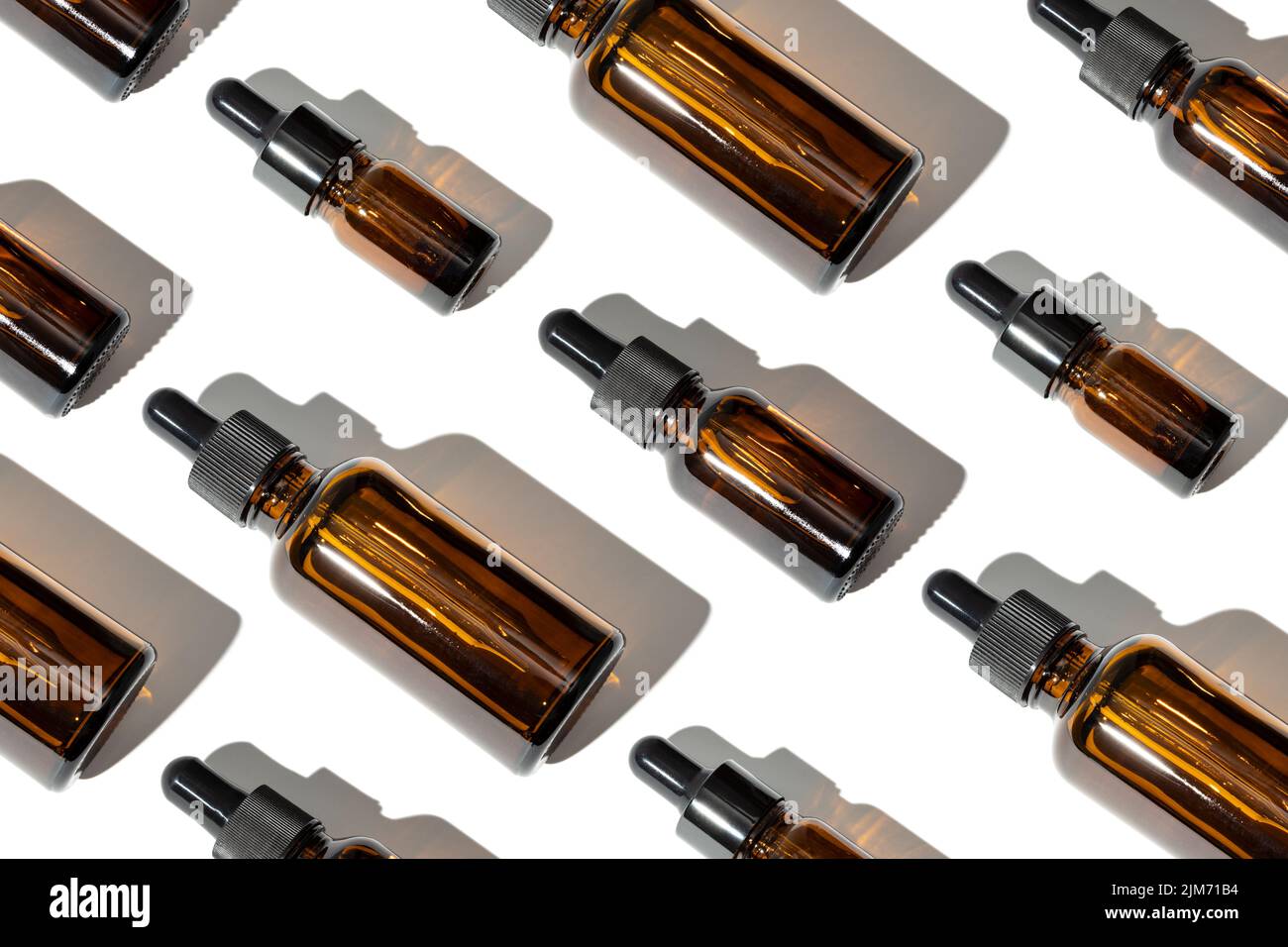 Group of Essential oil glass bottle with pipette. Variation of amber ...