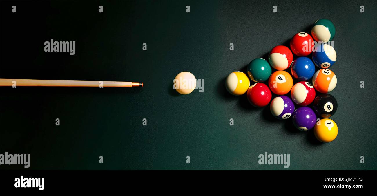 Pyramid made of billiard balls and cue on table, top view Stock Photo ...