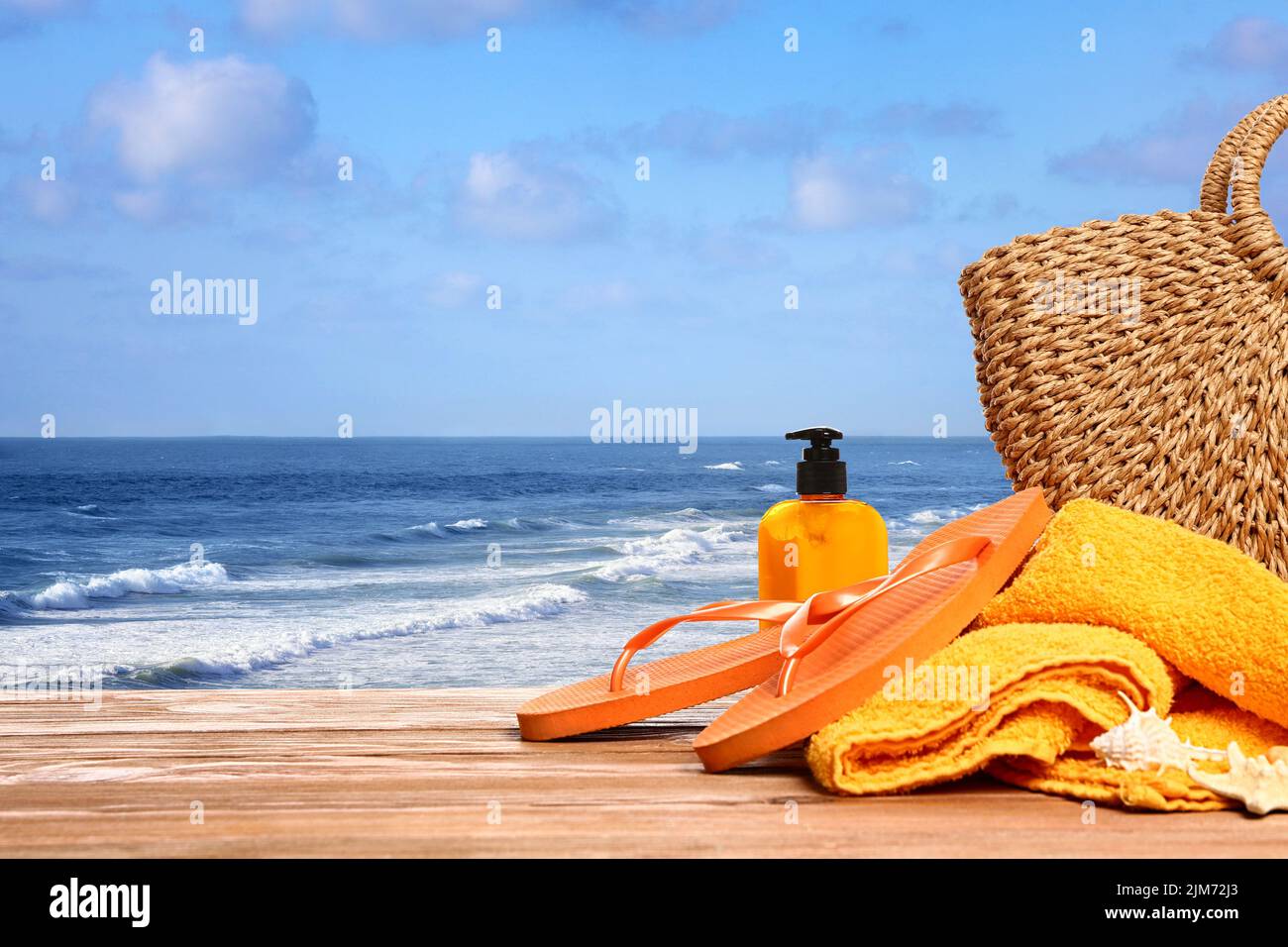 Set of beach accessories on table at sea resort Stock Photo - Alamy