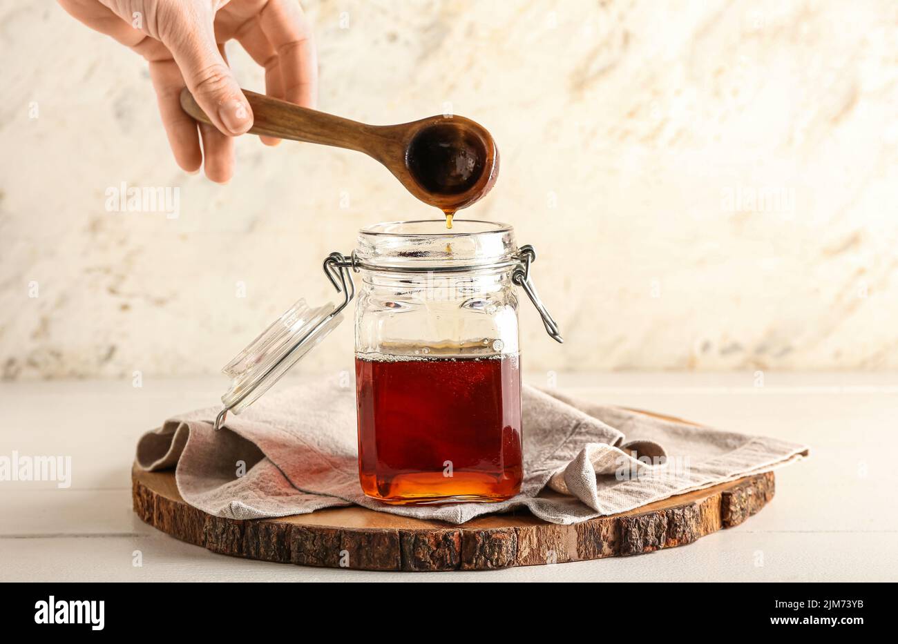 Woman pouring white syrup from hi-res stock photography and images - Alamy