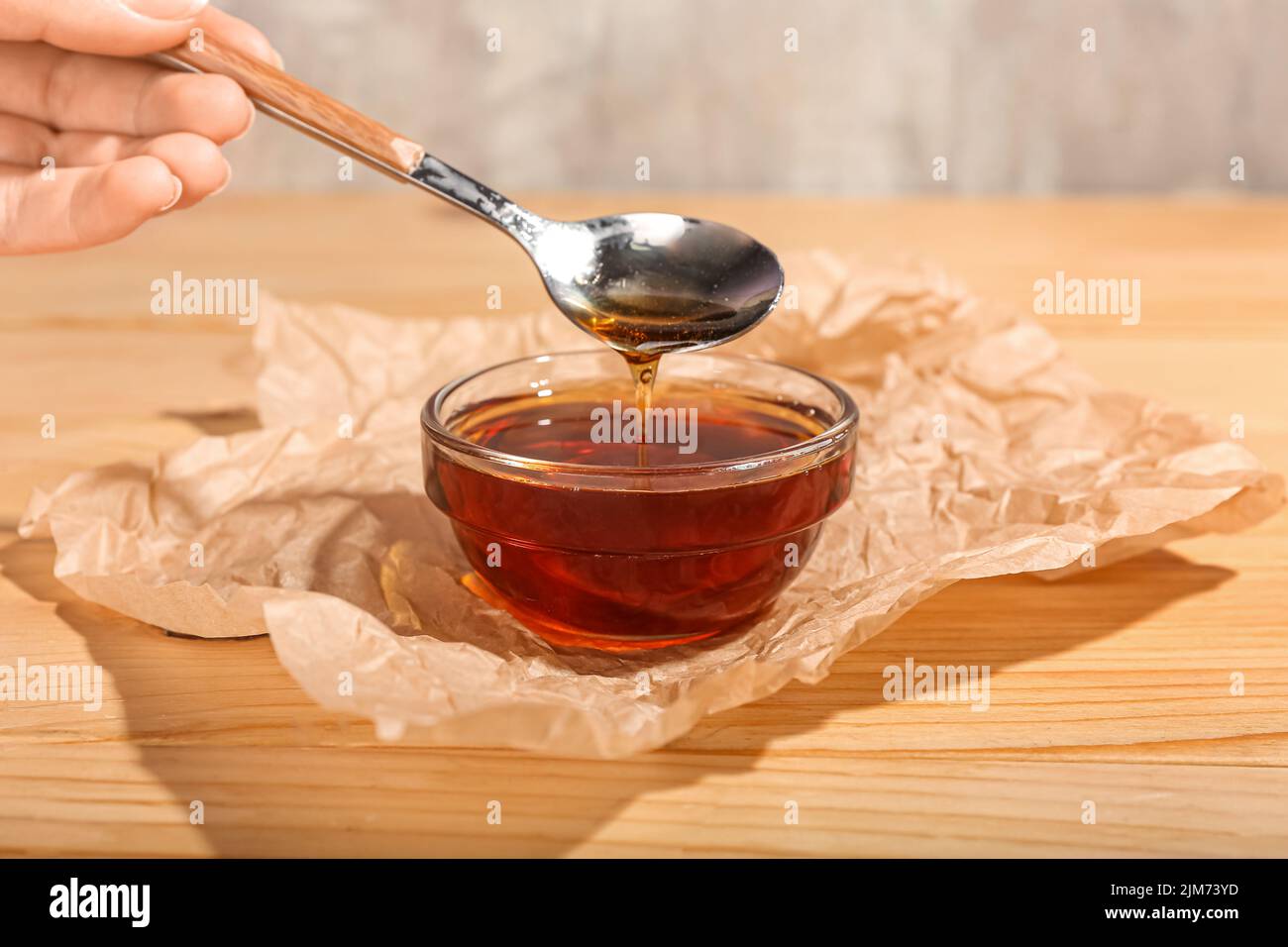 Person pouring sweet maple syrup hi-res stock photography and images ...