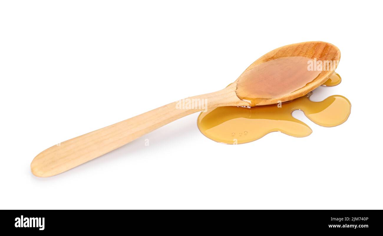 Wooden spoon with tasty maple syrup isolated on white background Stock ...