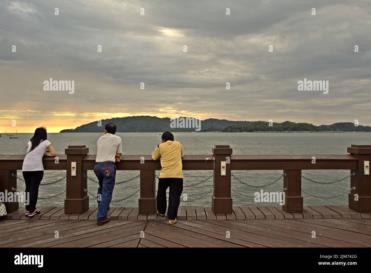 People enjoying afternoon seascape view as they are having a leisure time on a seaside viewing ...