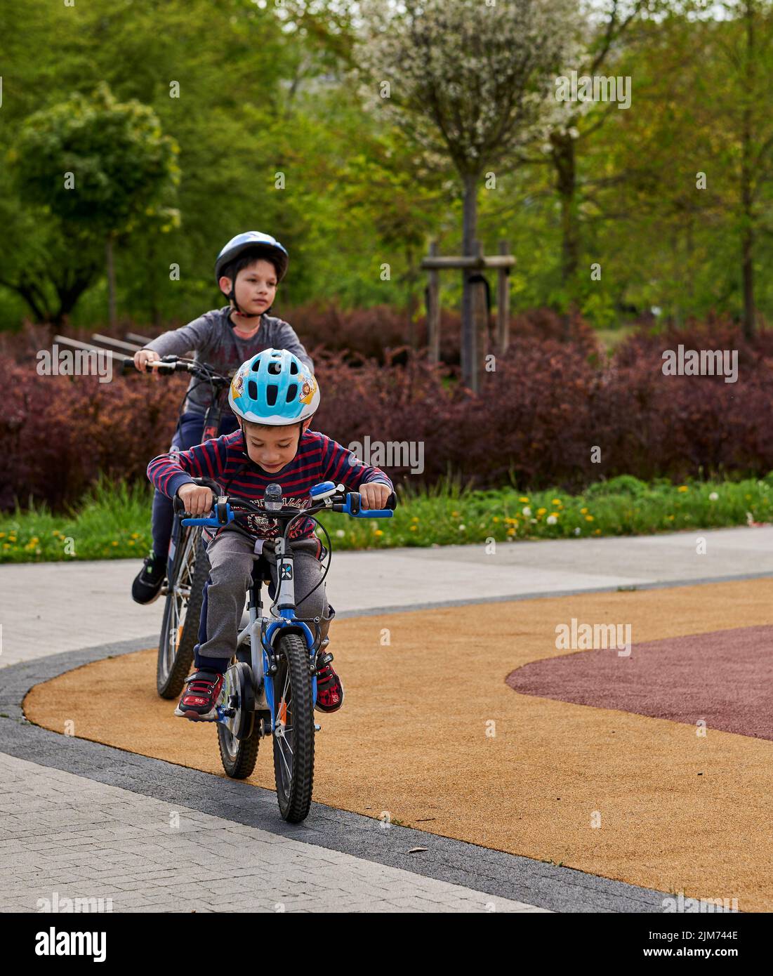 Two boys riding bicycle hi-res stock photography and images - Alamy