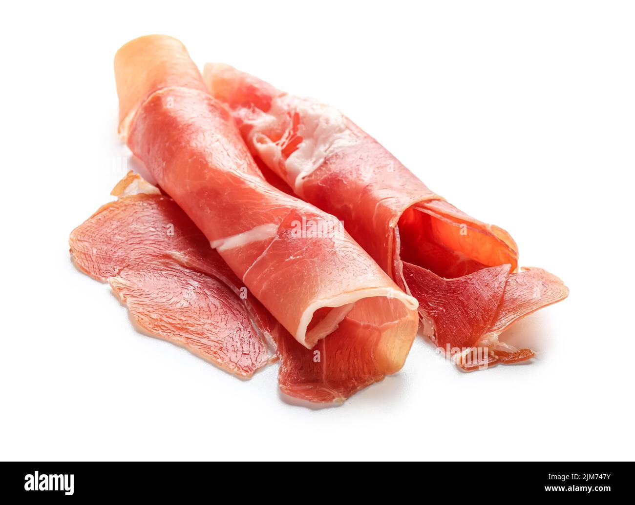 Rolled slices of jamon on white background Stock Photo - Alamy
