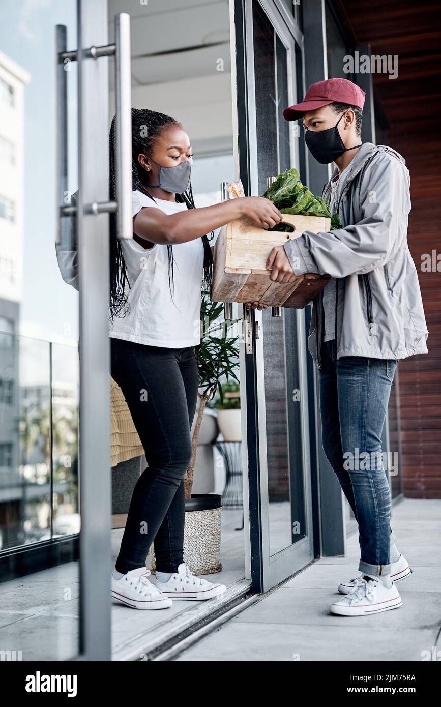 The faster the delivery, the more fresh your food. a masked young man ...