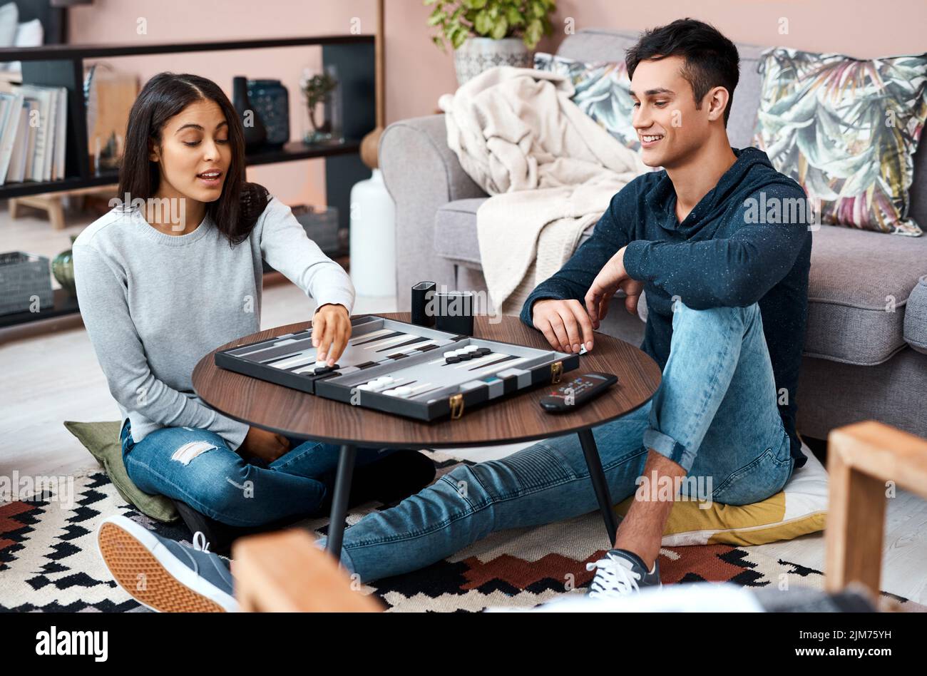 The healthy kind of game playing. a young couple playing a game of ...