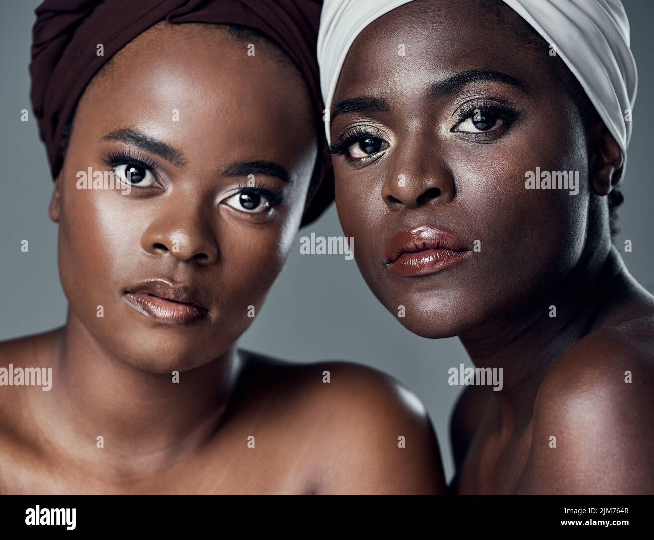 Were proud of our cultural background. Studio portrait of two beautiful ...