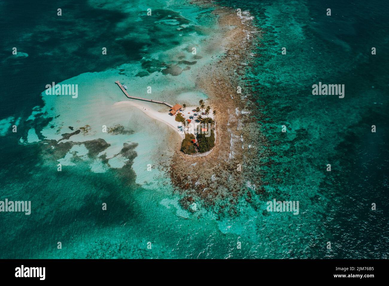 An aerial top view of the Caribbean Sea in the Goff's Caye island in ...