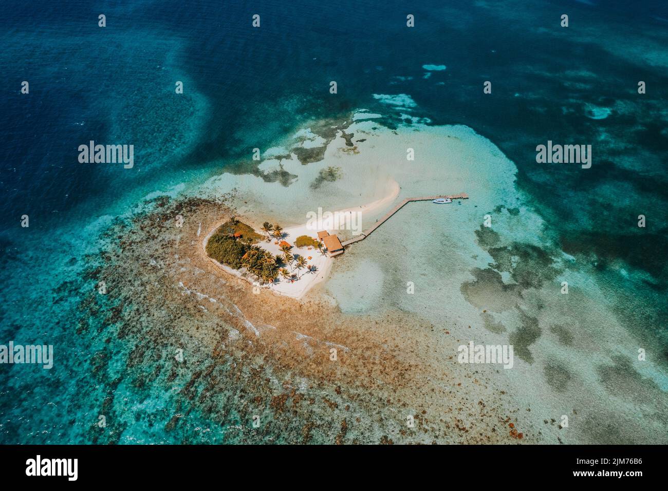 An aerial top view of the Caribbean Sea in the Goff's Caye island in ...