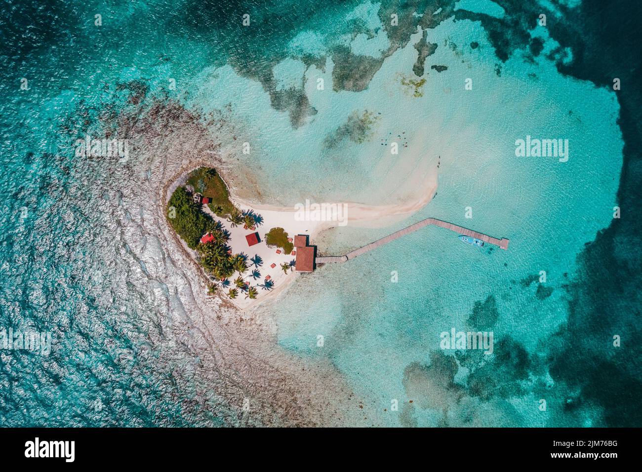 A breathtaking aerial top view of a small island in Belize surrounded ...