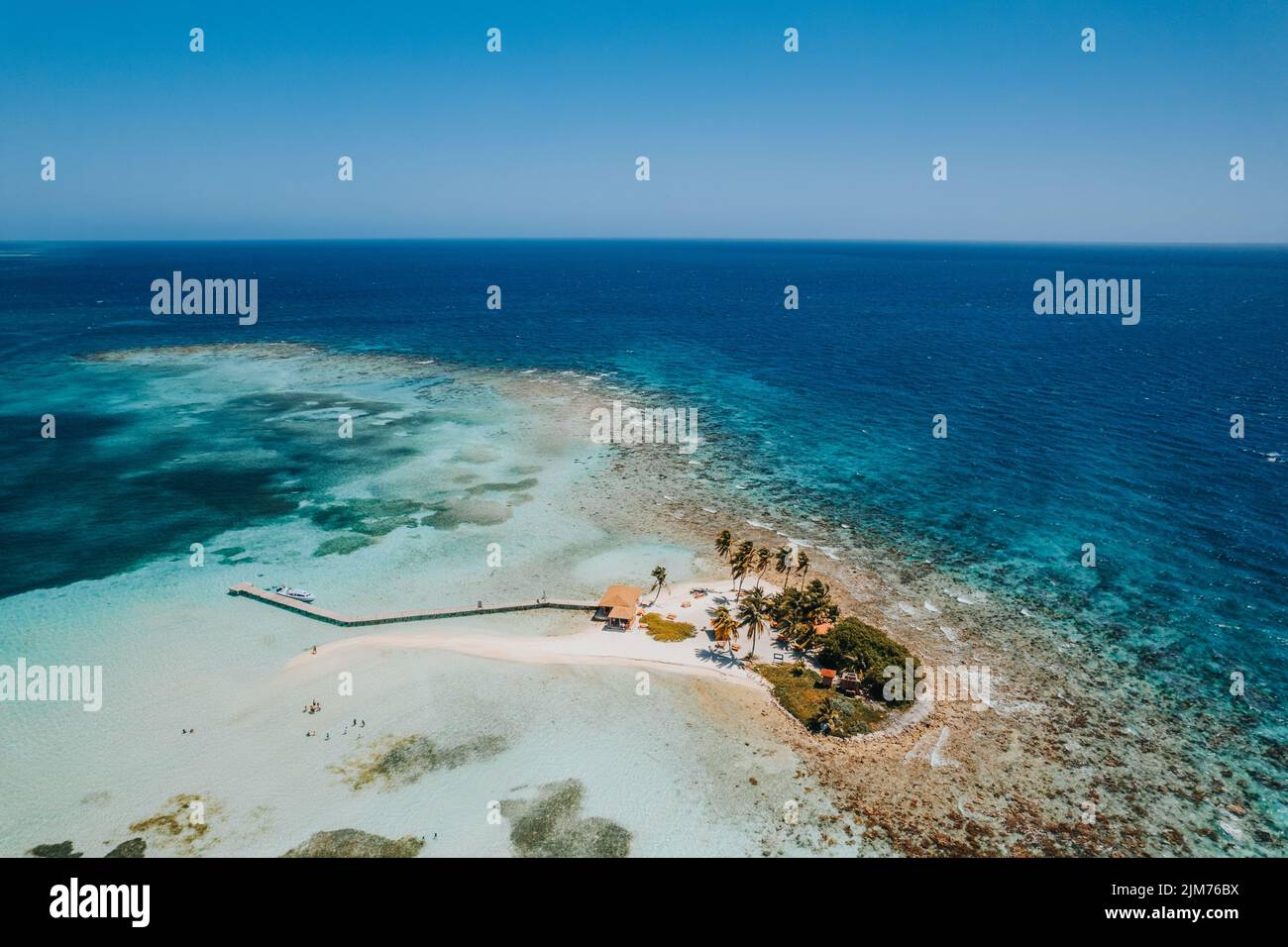 A breathtaking bird's eye view of a small island in Belize surrounded ...