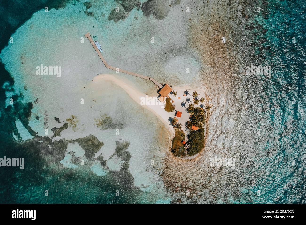 A breathtaking aerial top view of a small island in Belize surrounded ...