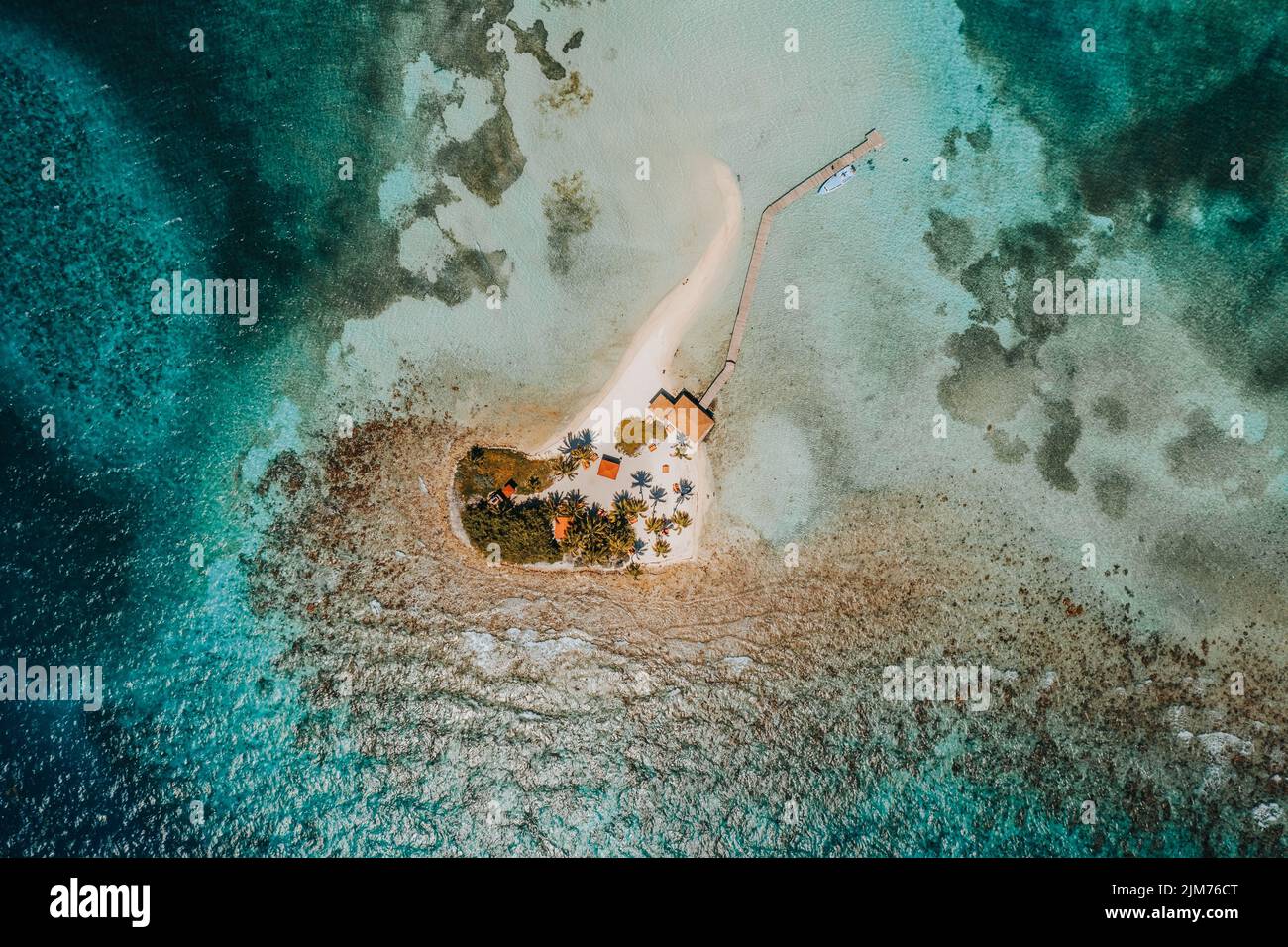 An aerial top view of the Goff's Caye island in the Caribbean Sea ...