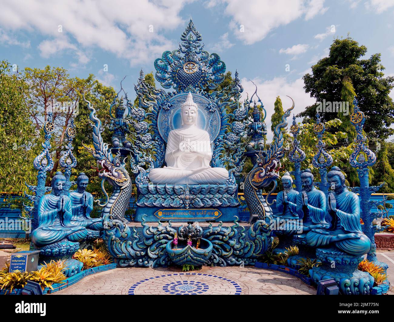A beautiful shot of a white Buda statue in Wat Rong Suea Ten (Blue ...