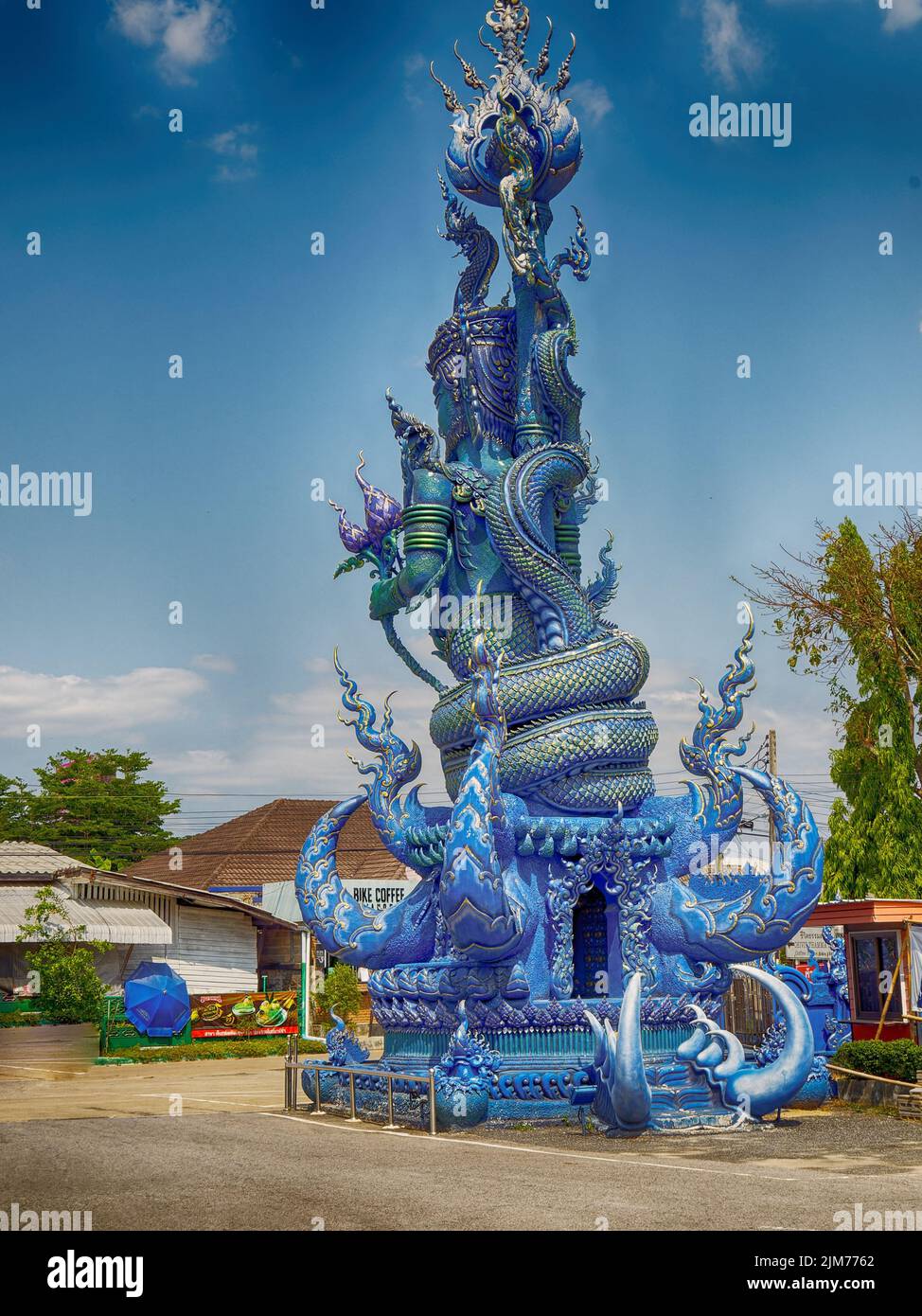 A beautiful shot of a big blue Buda statue in Wat Rong Suea Ten (Blue ...