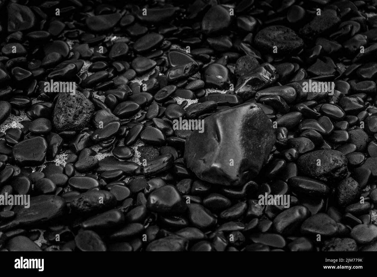 A grayscale shot of a beautiful texture of the wet stones Stock Photo ...