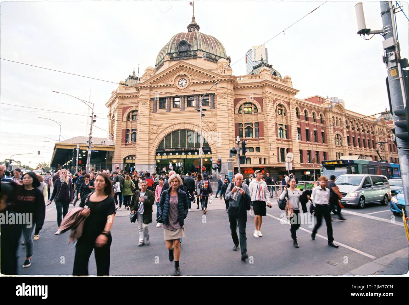 A group of people walking in the center of Melbourne during rush hour ...