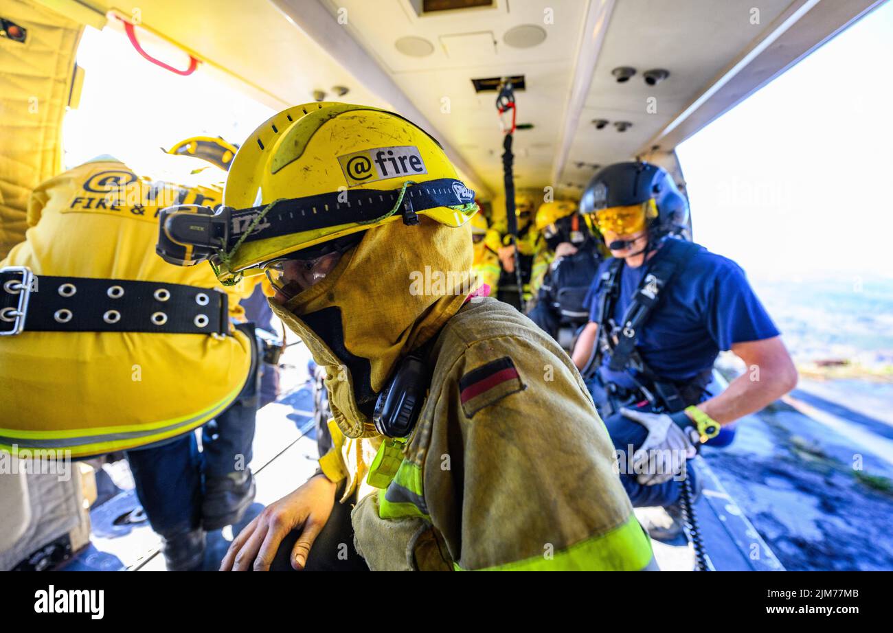 Bad Schandau, Germany. 03rd Aug, 2022. Volunteer firefighters of the ...