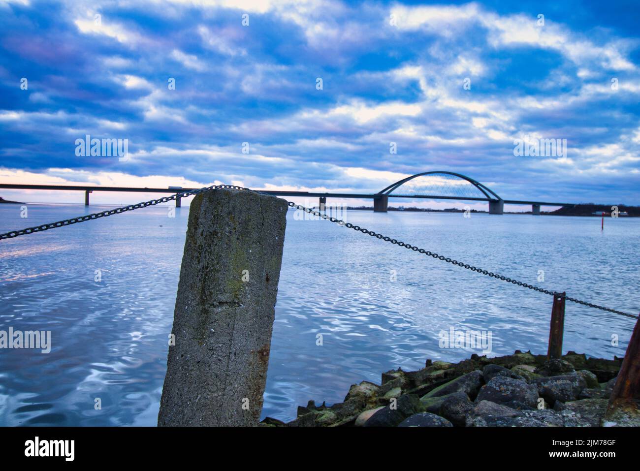 A huge blue cloudscape over the Fehmarn Sound Bridge over the Baltic ...
