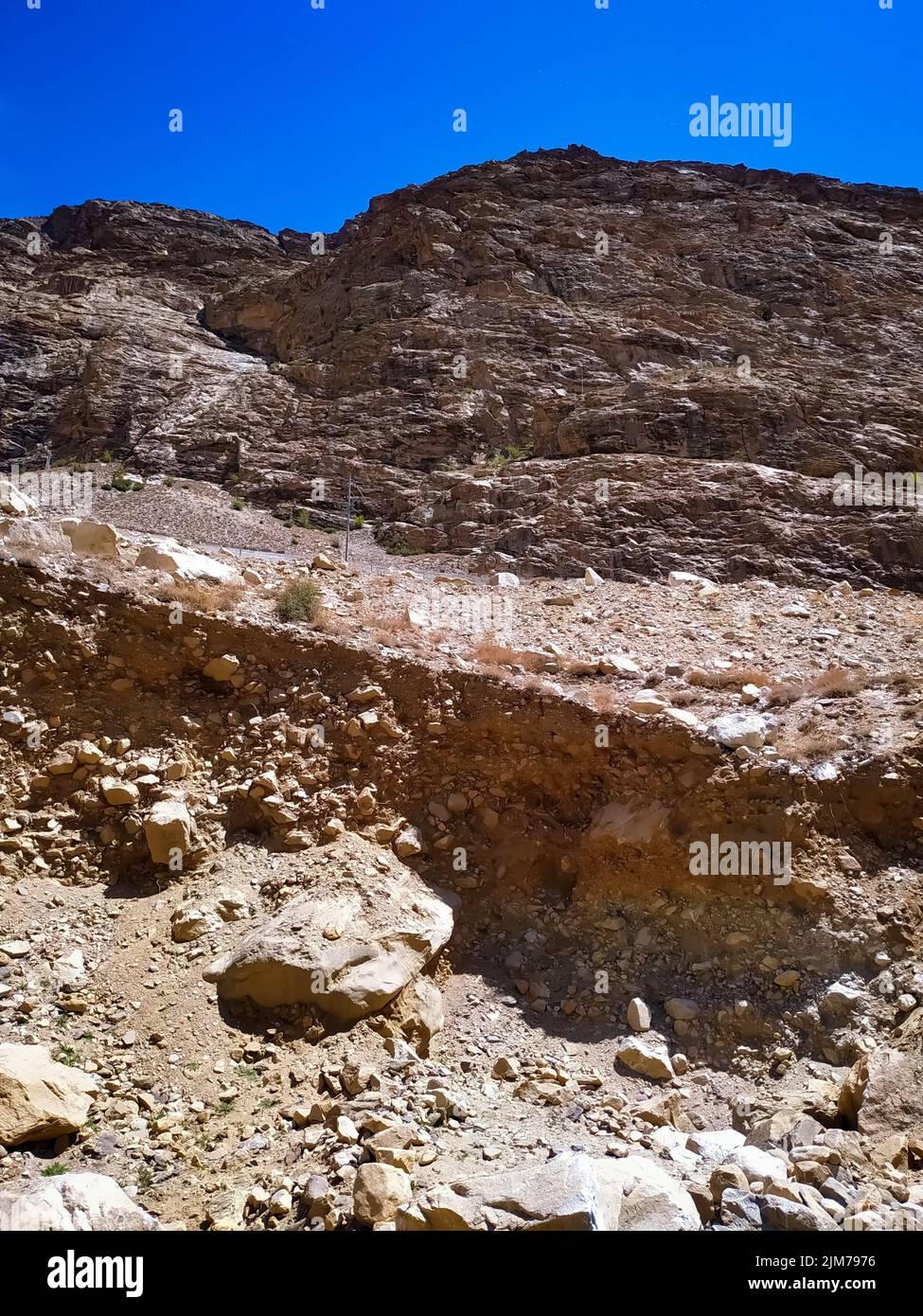 A beautiful view of a rocky mountain with a blue sky background Stock ...