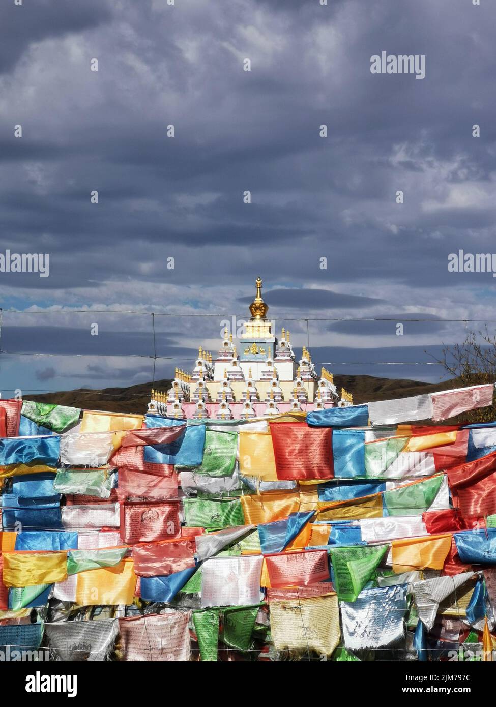 A beautiful view of Stupa of Enlightenment with fabrics hanging on ...