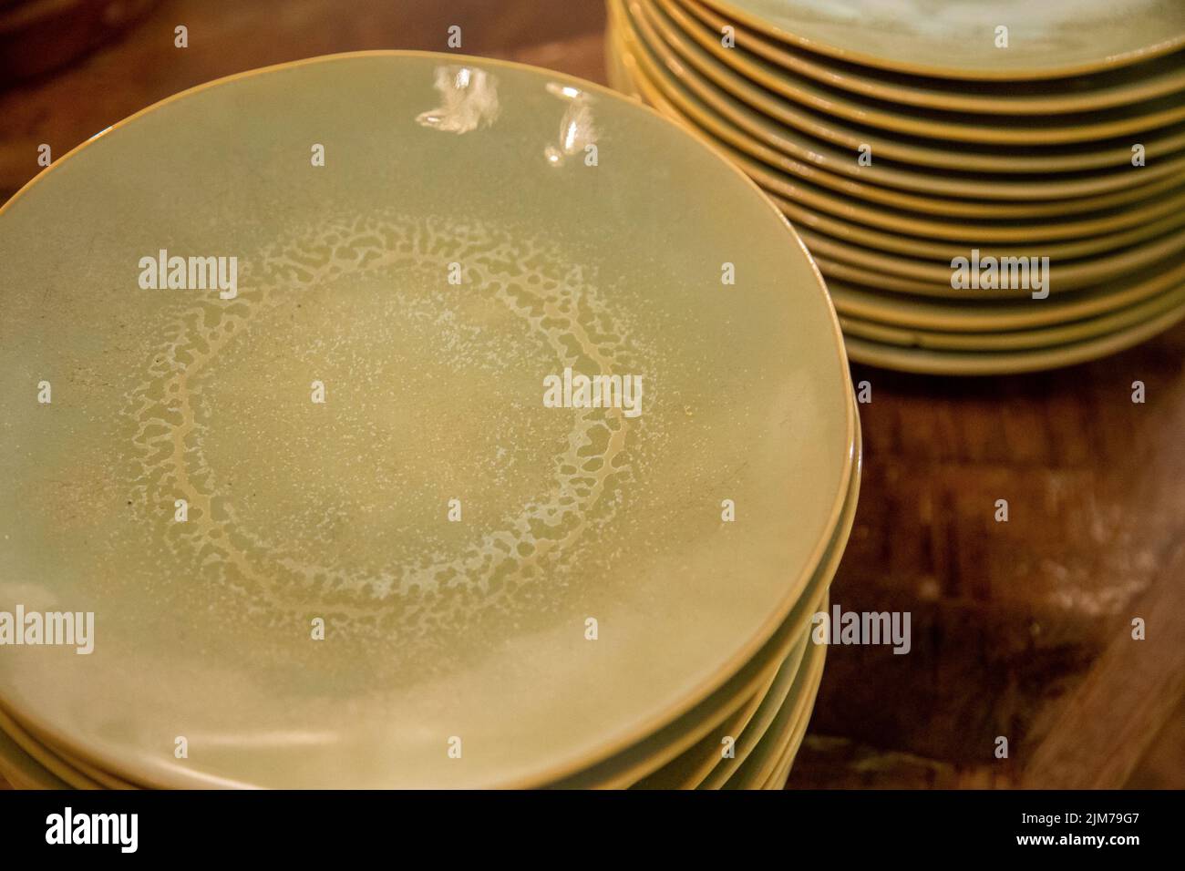 low light wood table green uneven artistic Stock Photo - Alamy