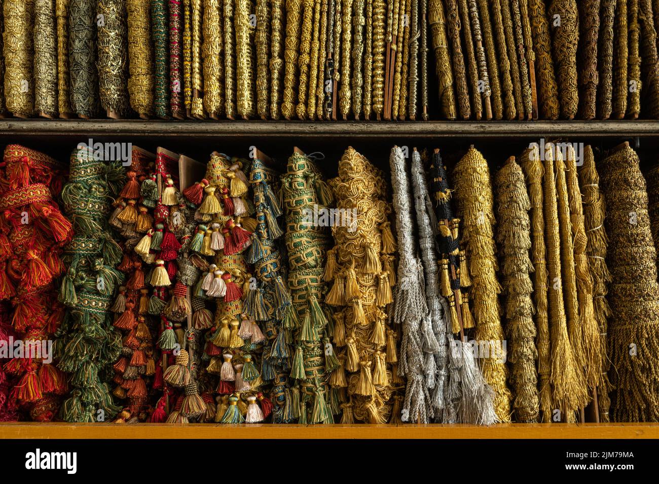 multi-colored braid on the counter of the store for decoration, sewing ...