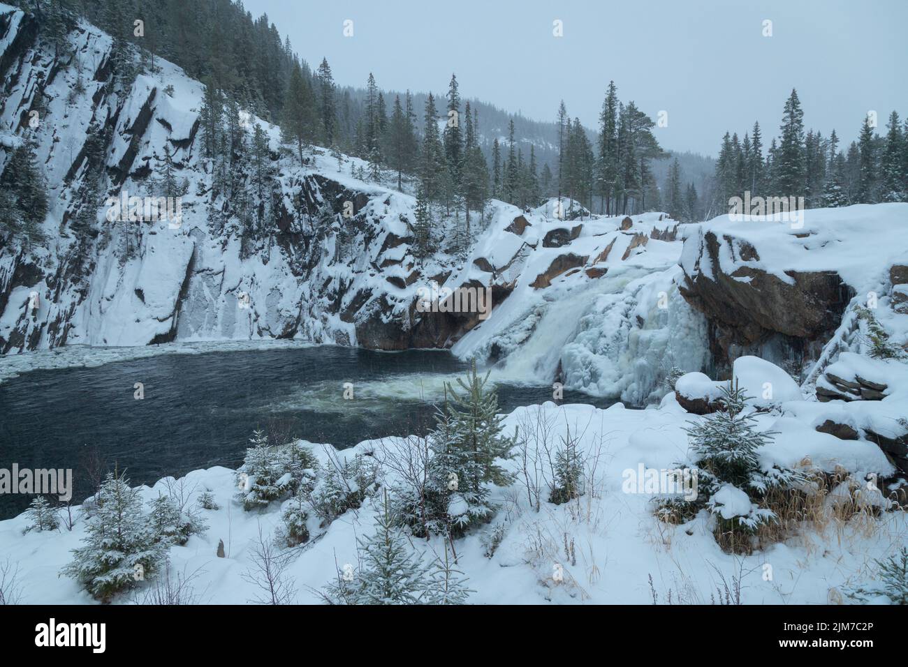 Hyttfossen waterfall on Gaula river in winter look. Snowy landscape of ...