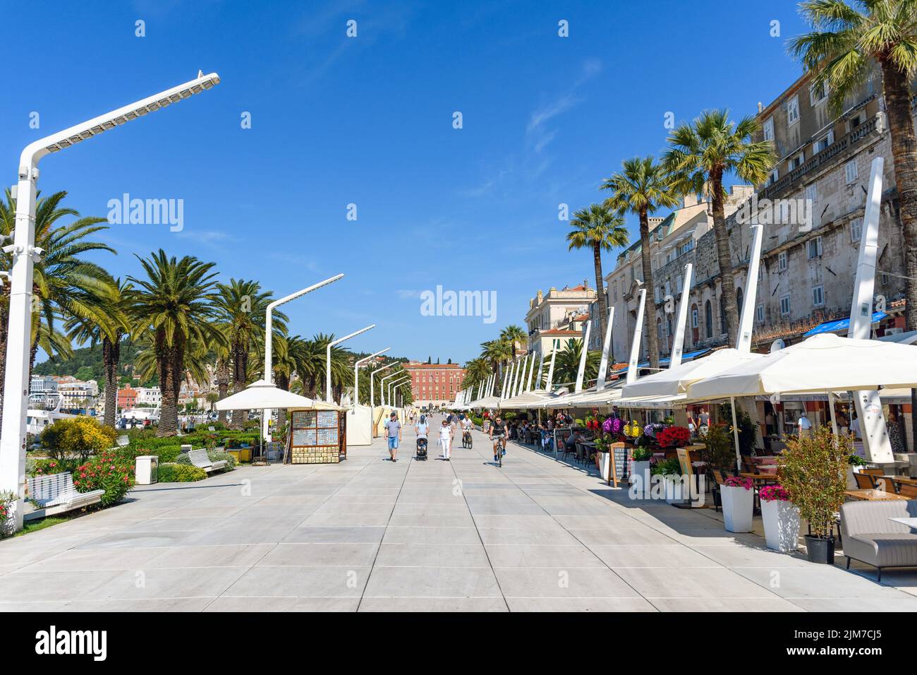 Incidental people walking on a sunny summer day on Riva street in Split ...
