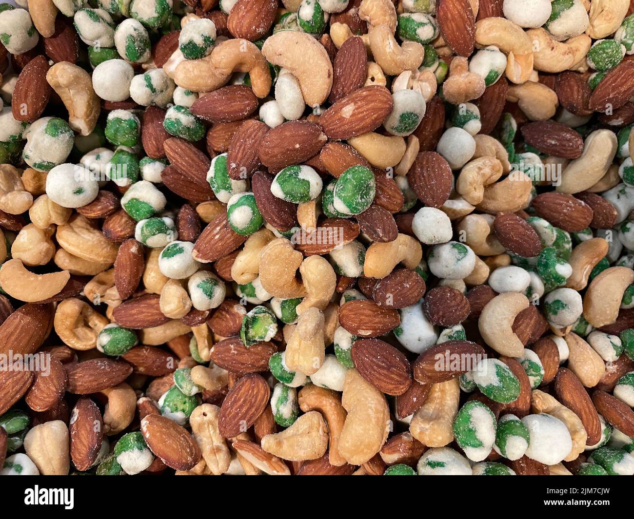 Grovetown, Ga USA - 12 20 21: Flat lay candy and nut mix green wasabi ...