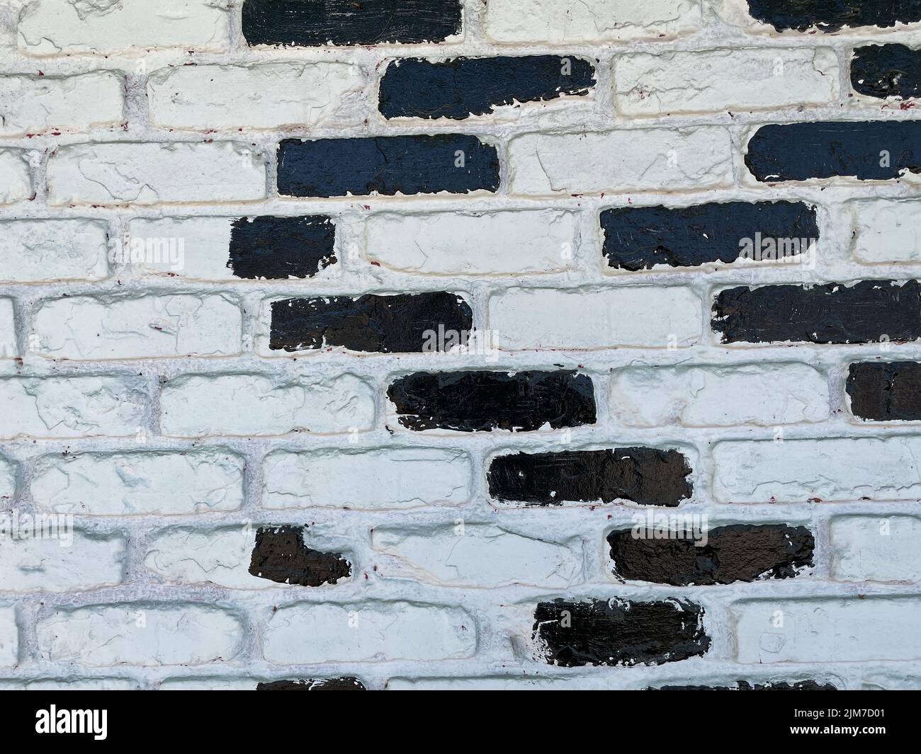 Augusta, Ga USA - 03 27 22: Black and white panted brick wall weird ...