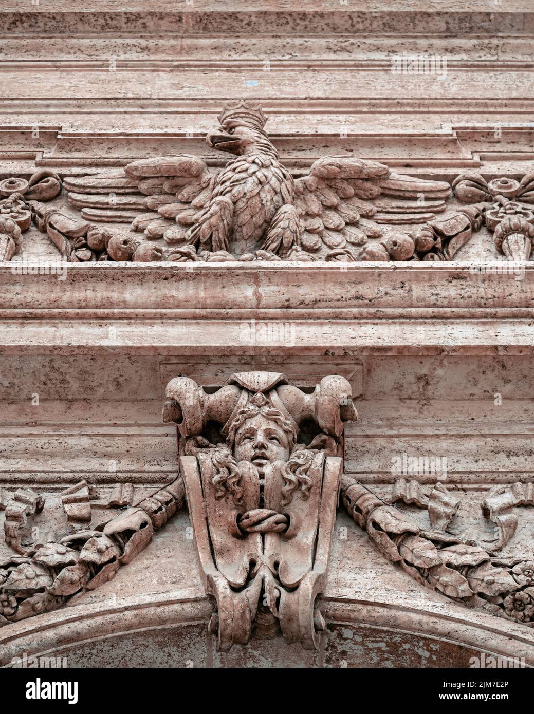A vertical shot of details of a historic structure of with statues ...