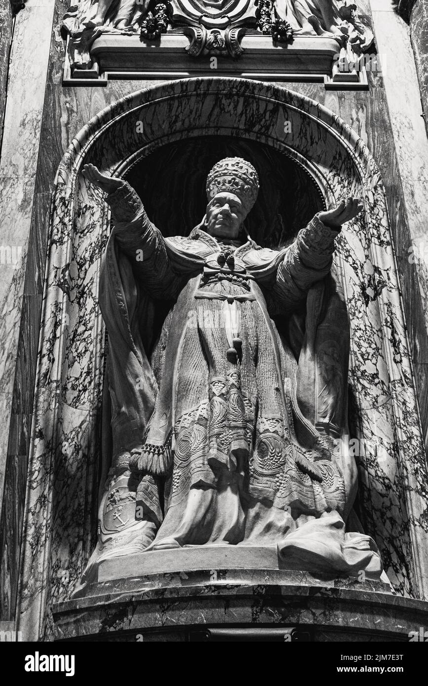 A vertical shot of details of a religious structure of with statues ...
