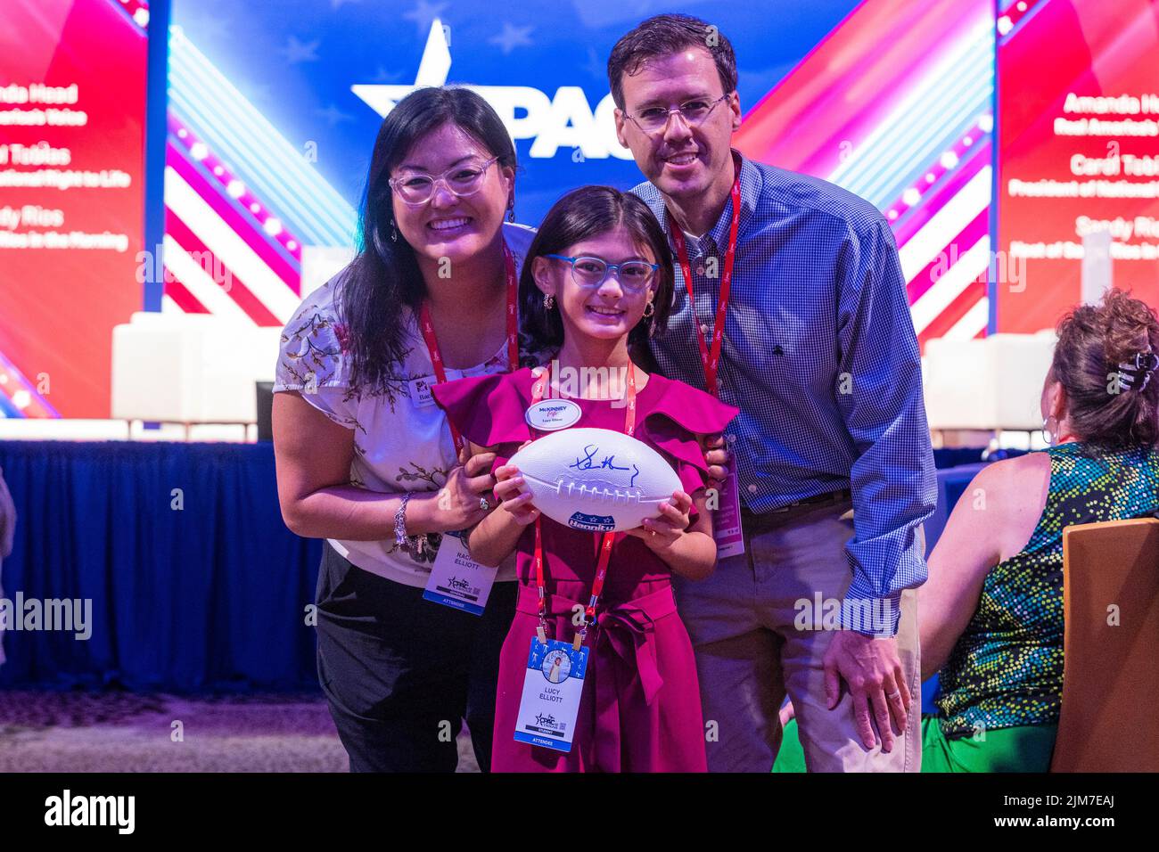 Dallas, TX on August4, 2022, Lucy Elliot with football signed by Sean ...