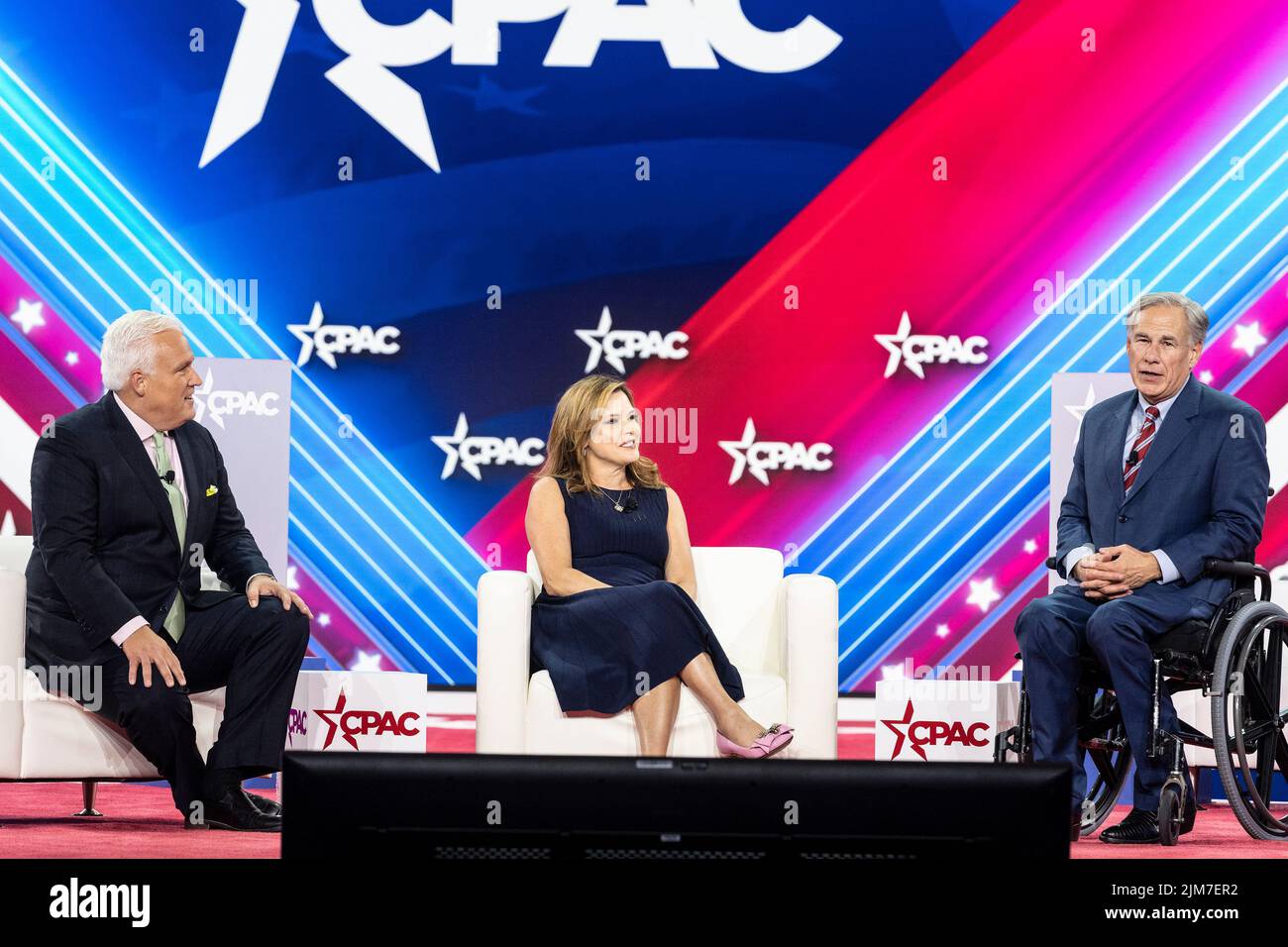Matt Schlapp, Mercedes Schlapp and Greg Abbott speak during CPAC Texas ...