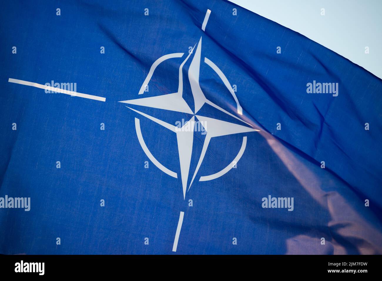 NATO (North Atlantic Treaty Organization) flag waving. NATO is an ...