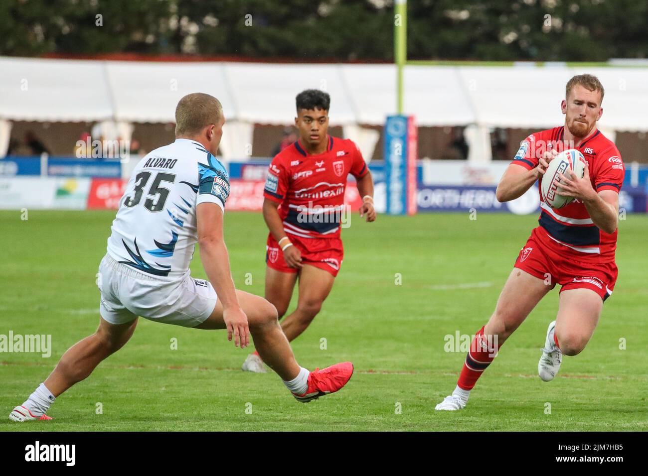 Rowan Milnes #21 of Hull KRlooks to go past Dan Alvaro #35 of Toulouse ...